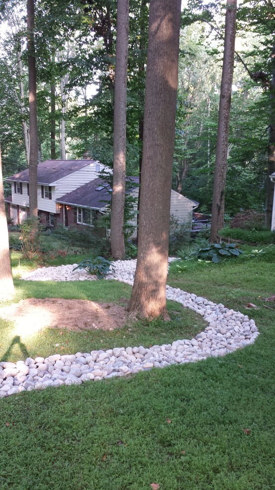 Landscaping and river rock drainage swale - Traditional - Landscape ...