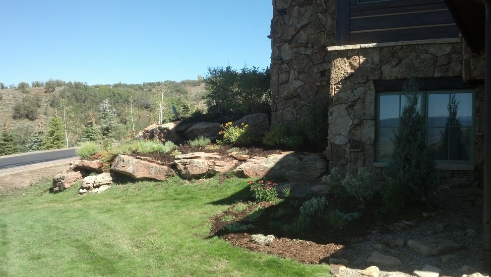 Moss boulders with continuous bloom plants - Rustic - Landscape ...