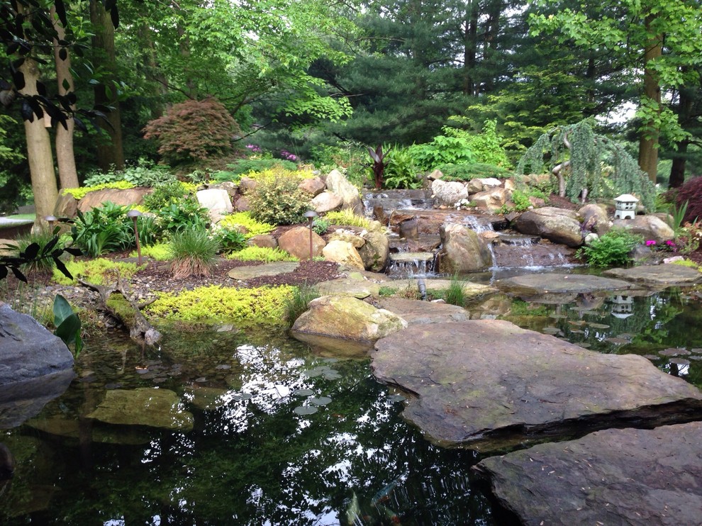 Natural Koi Pond with bridges that you walk across going to the front ...