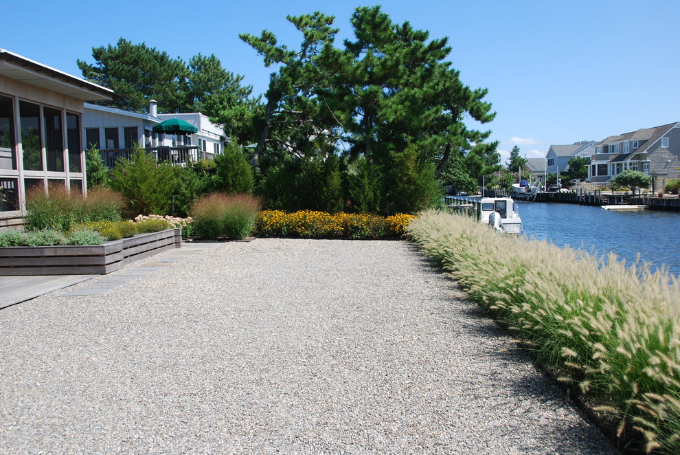Outdoor space with perimeter plantings - Beach Style - Landscape - New ...