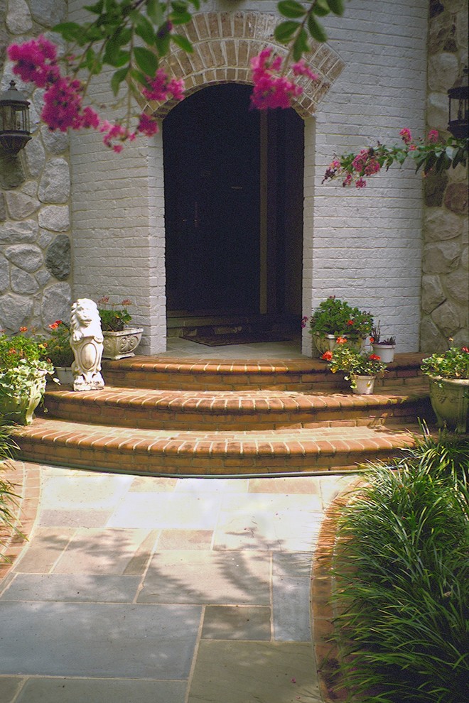 Painted Brick Entryway w Arch, Steps and Bordered Stone Walkway ...