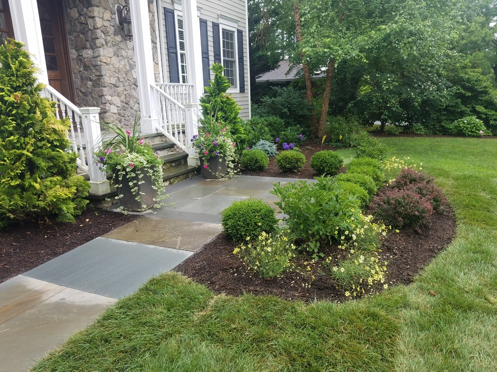 Patio with stone wall and fire pit - Traditional - Garden - New York ...