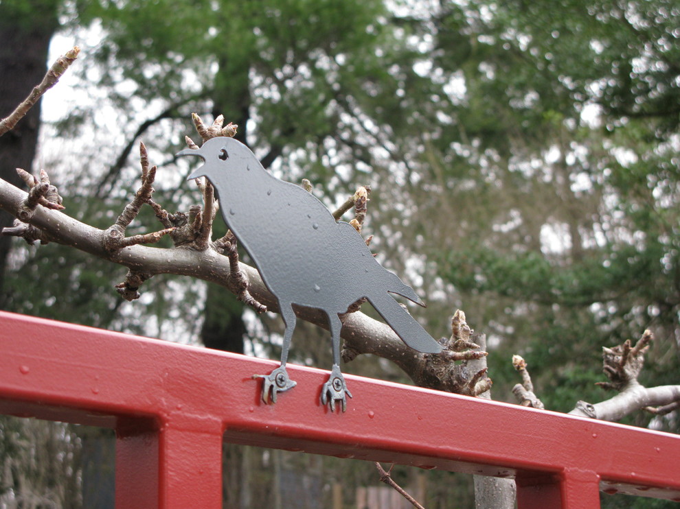 Pear espalier and crow cutout atop custom trellis - Transitional ...