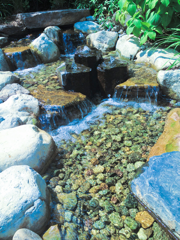 pondless waterfall with basalt columns and river rock stream ...