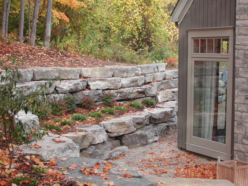 Rustic two tiered armour stone retaining - Traditional - Landscape ...