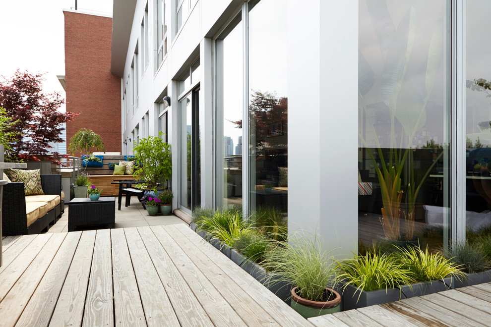 Sleek L-Shaped Rooftop Living Space - Modern - Landscape - New York ...