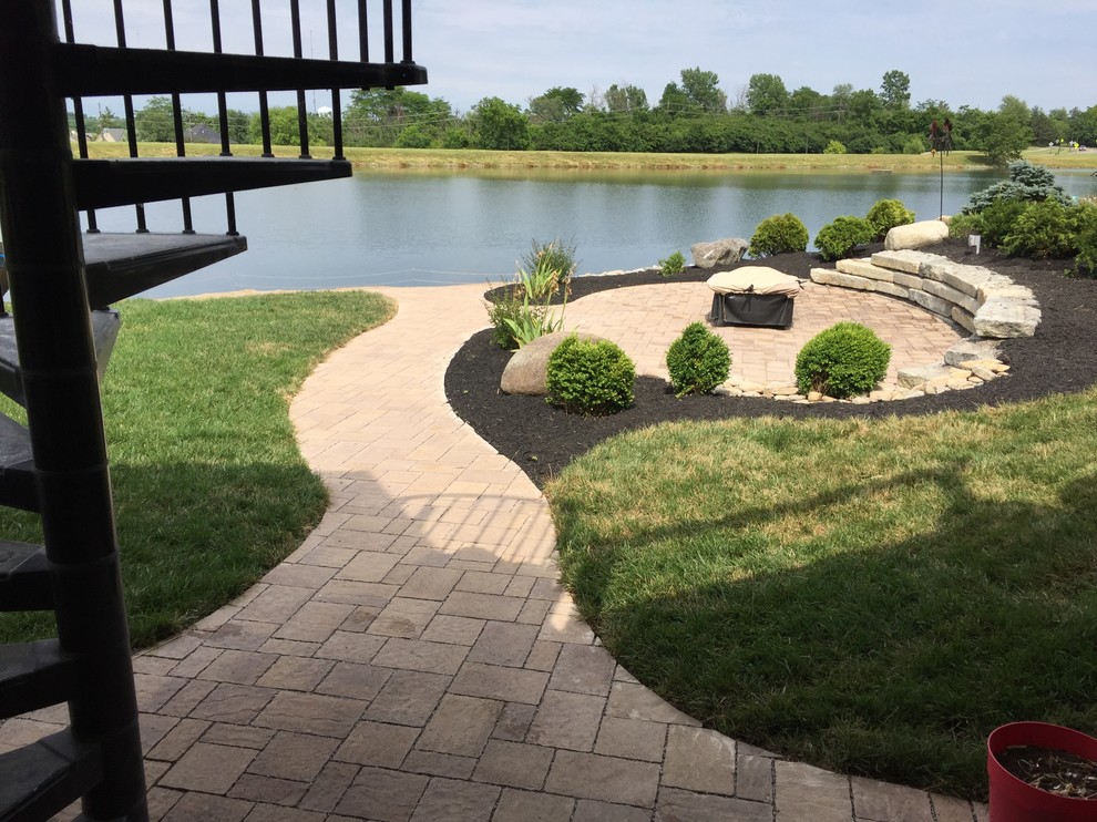 Suburban Lakeside Outdoor Living Space - Beach Style - Landscape ...