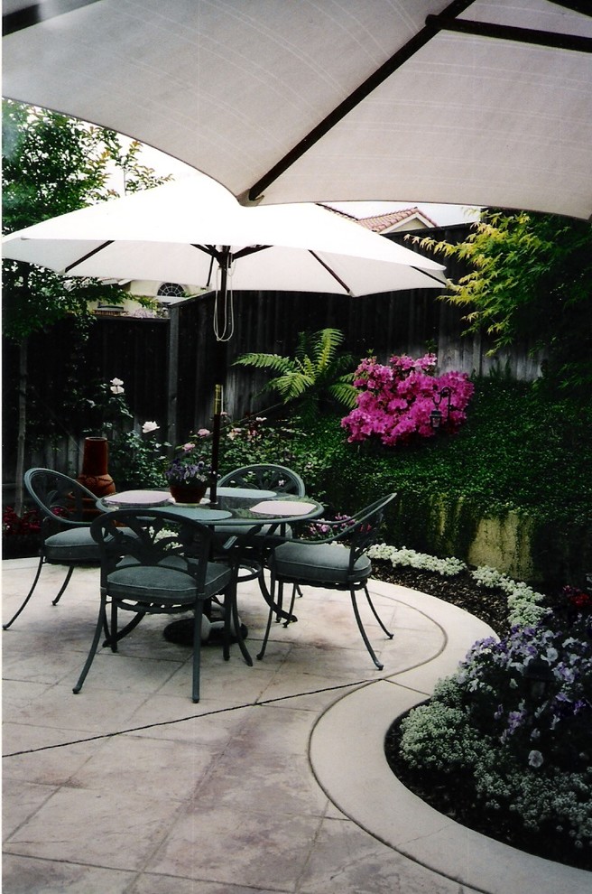 Super small garden with stamped concrete and year-round color ...