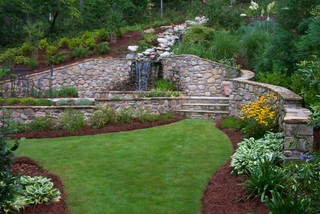 Terraced retaining walls with water feature - Mediterranean - Landscape ...
