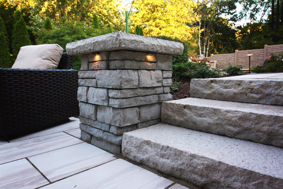 Unilock's Rivercrest pillar, Ledgestone steps, & porcelain tile ...