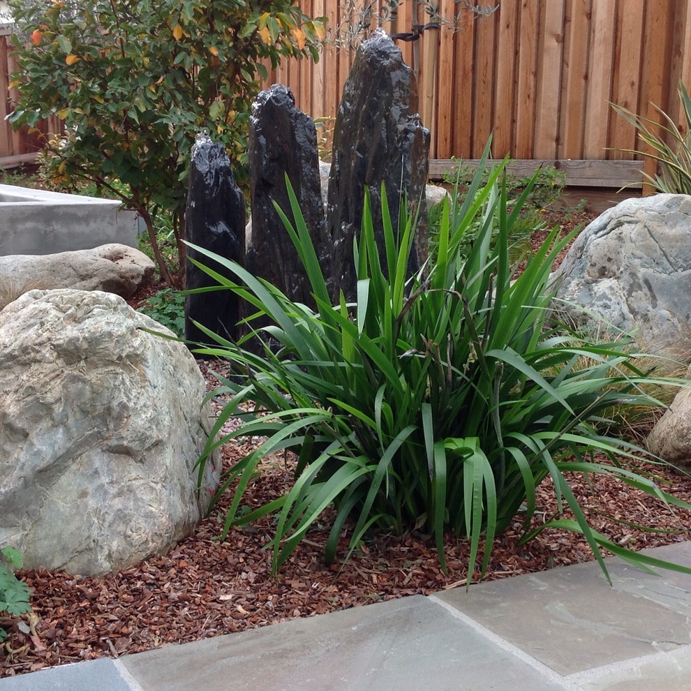 Water features, planting, boulders, mulch and basalite pillar water ...