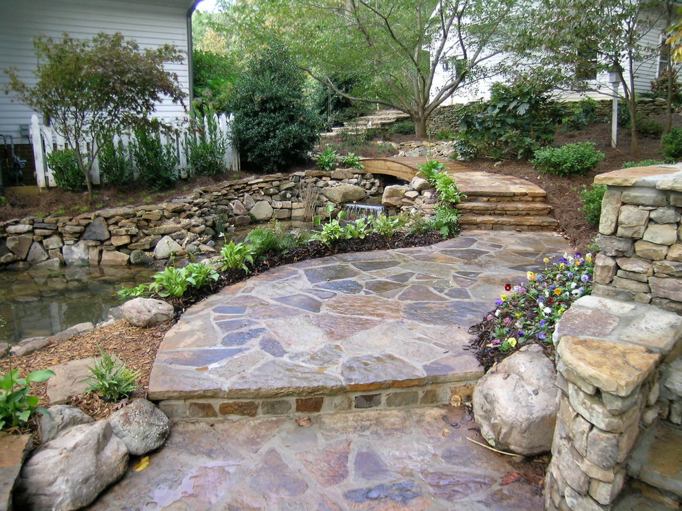 Waterfall and ponds along curving pathway. - Traditional - Landscape ...