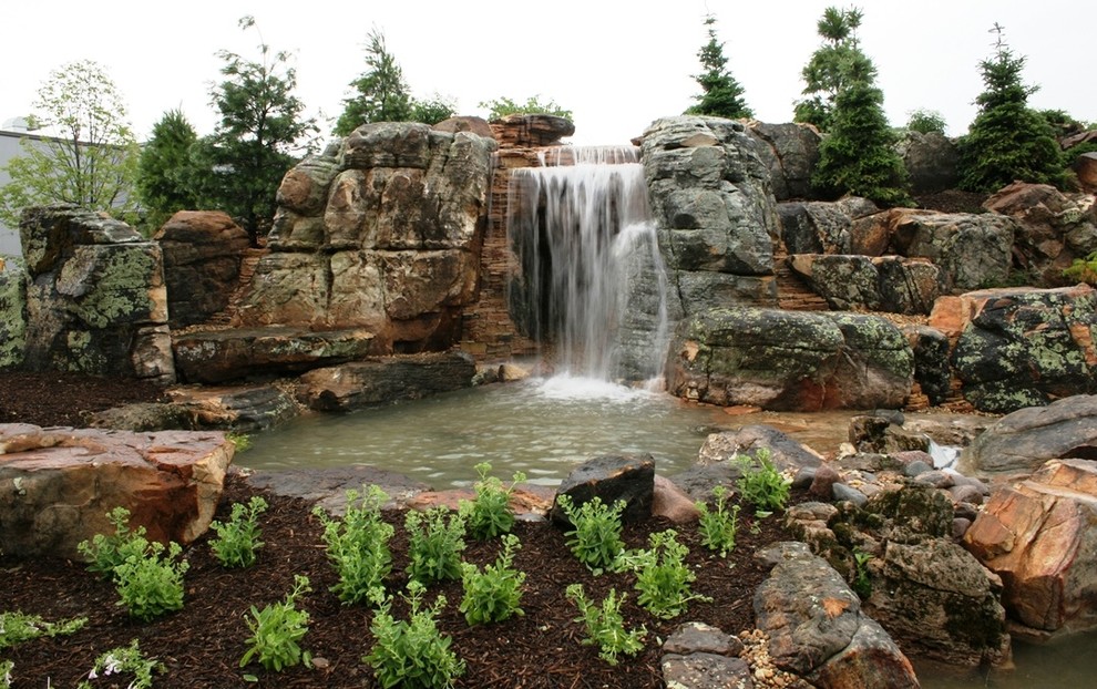 Waterfall flowing over 10 foot tall Grotto Cave at Worlds most extreme ...