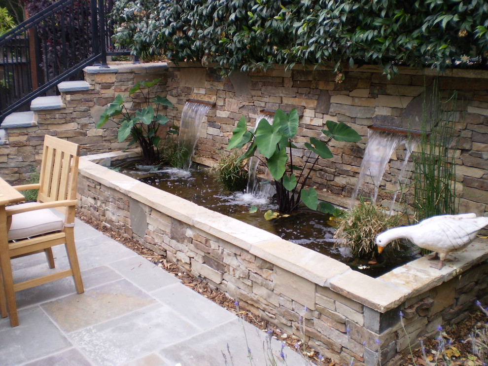 Waterfeatures, flagstone and veneered water feature planted with ...