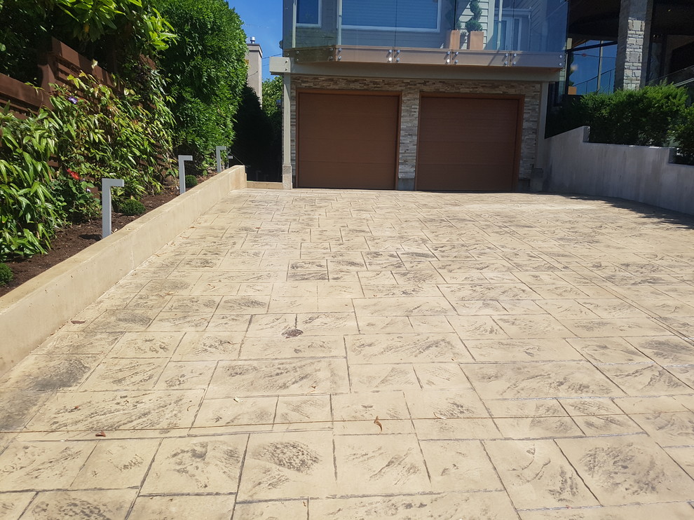 West Vancouver Stamp driveway with built in retainer - Transitional ...