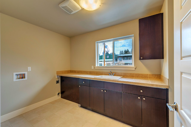 8. Laundry room with cabinets and sink / Suncadia - Contemporary ...