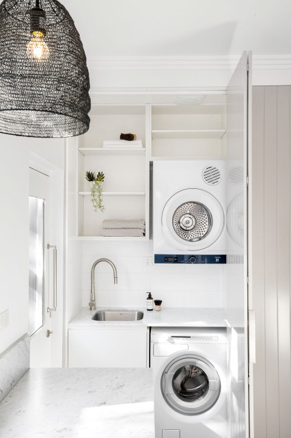 Integrated laundry with bi-fold doors - Beach Style - Laundry Room ...