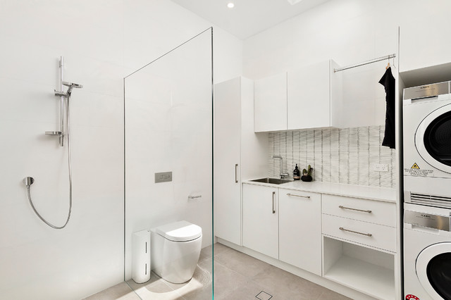 Minimalist laundry with tiled splashback - Modern - Laundry Room ...