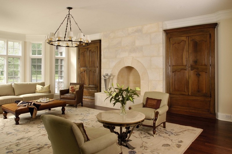 Floor to Ceiling Limestone Fireplace Flanked by Knotty Cherry Armoires ...