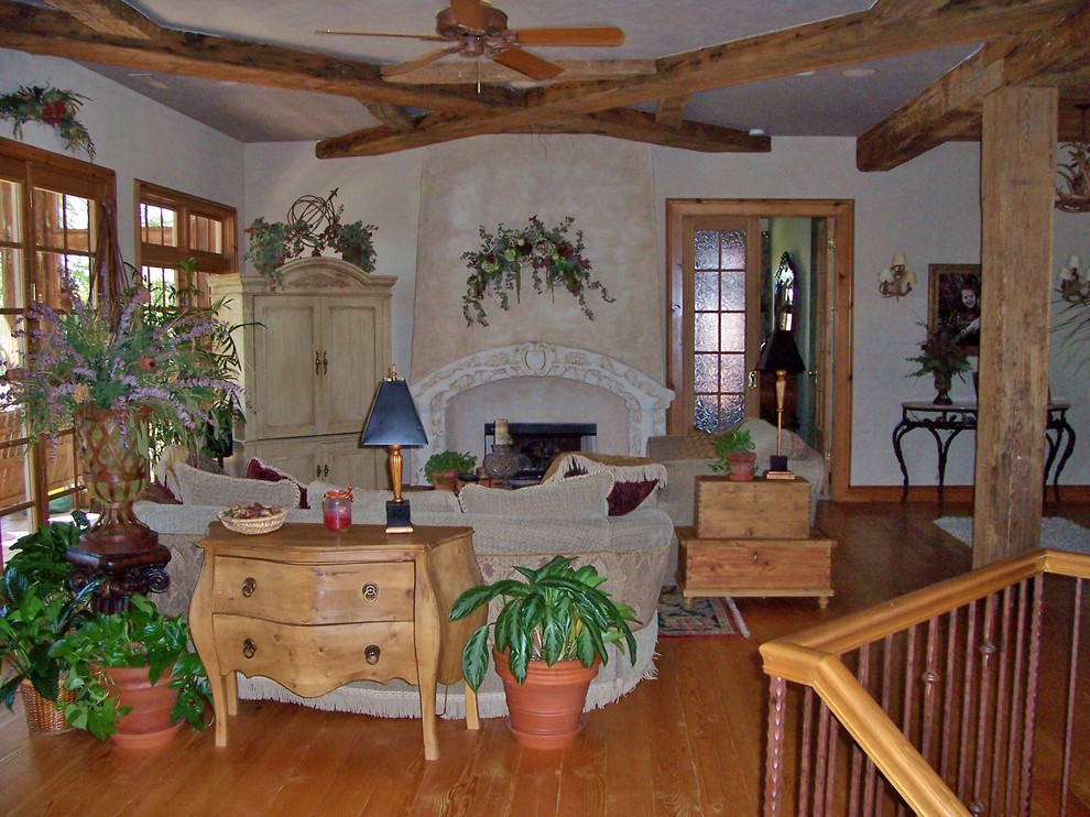 Inviting French Country Living Room w/stucco and cast stone fireplace ...