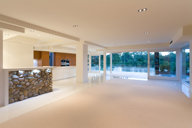 Massive white painted slider doors from Eden Made create a sense of ...