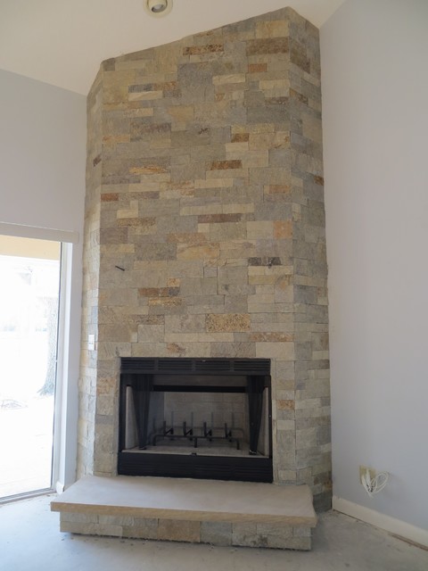 Natural Stone Veneer Indoor fireplace with Angled Walls and Ceiling ...
