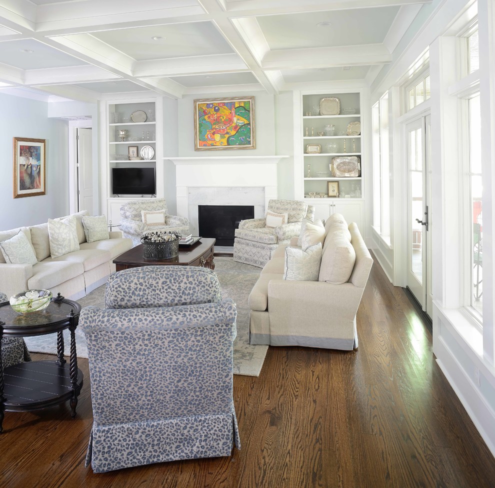 Open concept living room with large windows with view to backyard ...