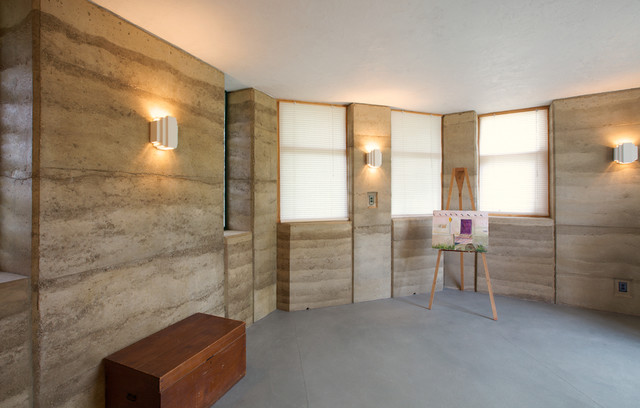 Out-of-the-box Passive Solar Rammed Earth Home - Living Room ...