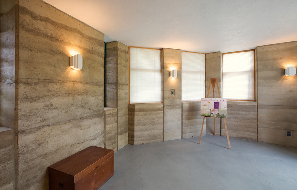 Out-of-the-box Passive Solar Rammed Earth Home - Living Room ...