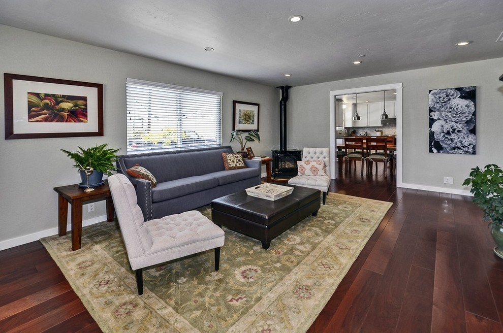 Second living room view with glimpse of kitchen and dining area ...
