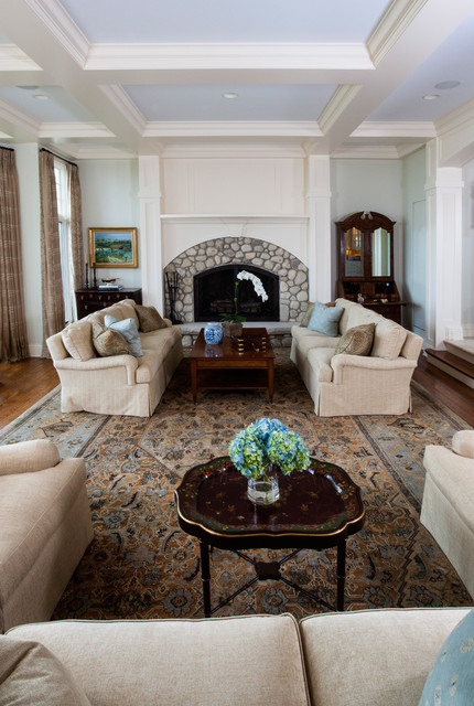 Step Down Living Room with Coffered Ceiling and Stone Fireplace ...
