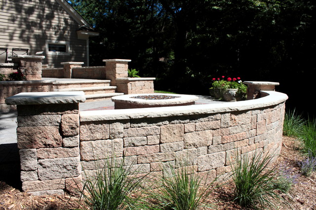 A retaining wall also used as a sitting wall around the fire pit ...