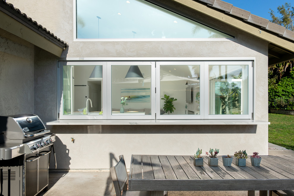AG BiFold Patio Door & Window Pairing Connects All-White Kitchen to the ...