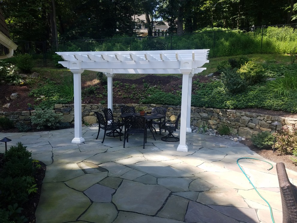 Backyard irregular patio with pergola and lighting - Traditional ...