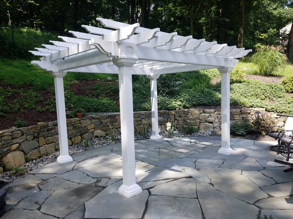 Backyard irregular patio with pergola and lighting - Traditional ...