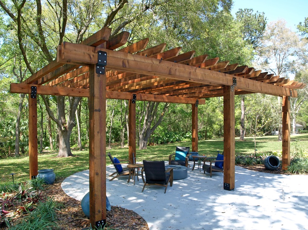 Backyard Tudor revival landscape along a natural area with a stream ...