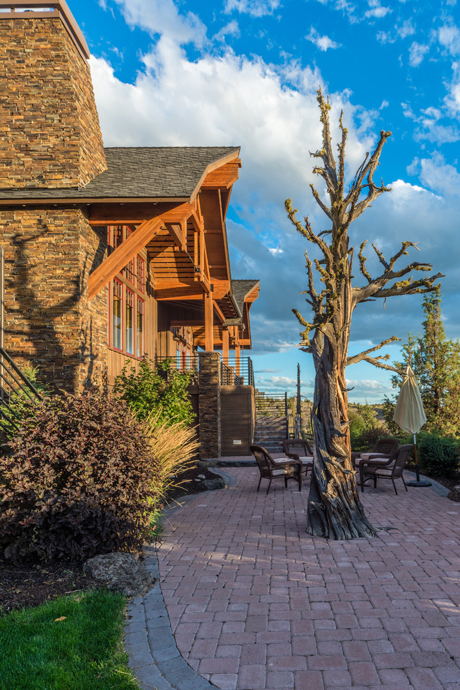 Brasada Ranch home ground level pavered decking - Rustic - Patio ...