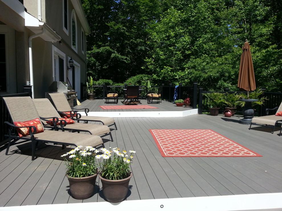 Composite decks, balcony, and poolside cabana with stucco accents ...