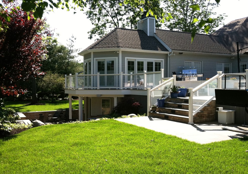 Decks cascade to the landscape with Brick and Bluestone Hardscaping ...