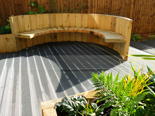 Floating bench and concealed BBQ - Tropical - Patio - London - by ...