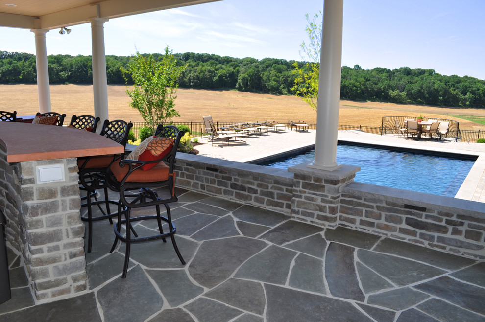 Interior of open air pool house with flagstone floor - Traditional ...