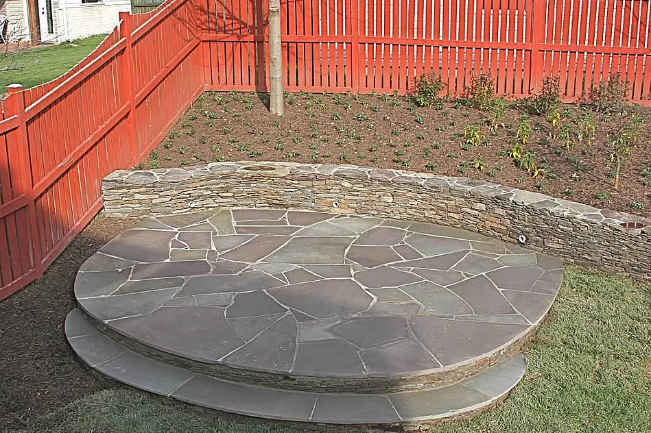 Irregular Flagstone Patio with Retaining Wall - Traditional - Patio ...