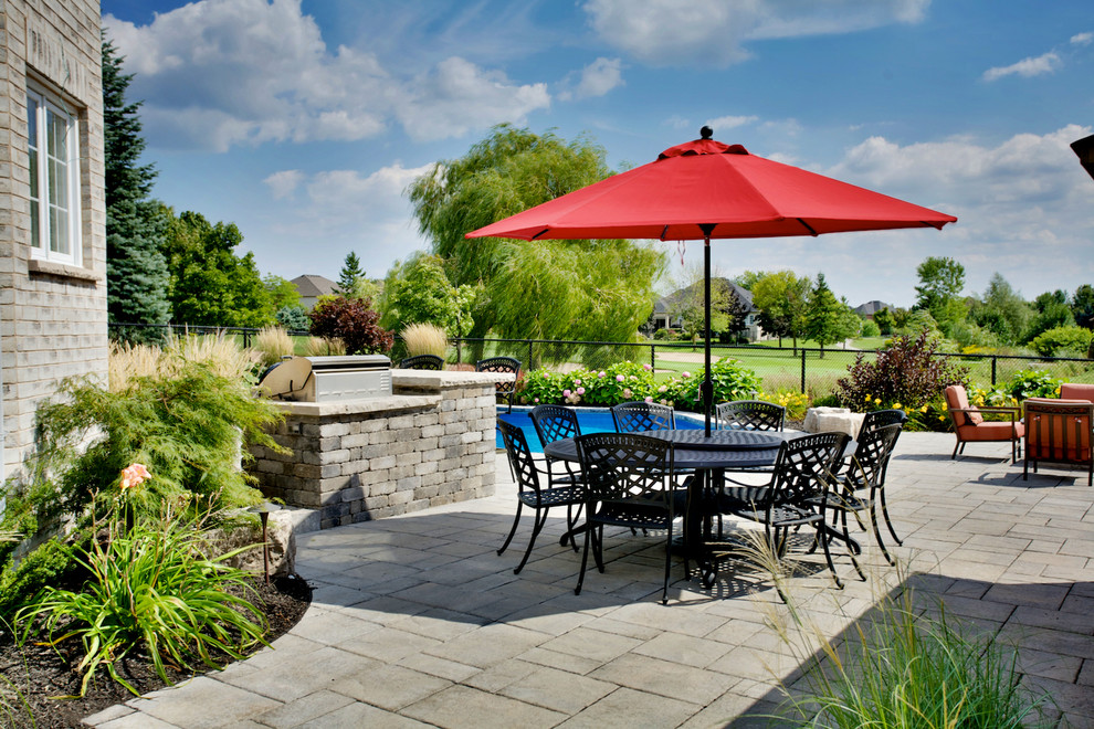 Lush backdrop for stone patio with pool - Transitional - Patio ...