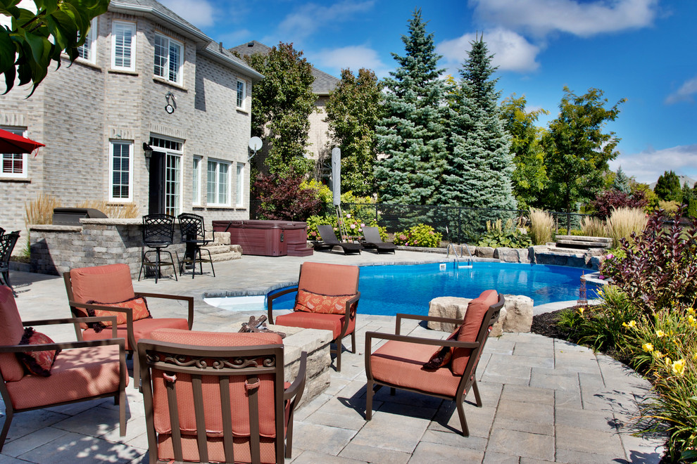 Lush backdrop for stone patio with pool - Patio - Toronto - by Outdoor ...