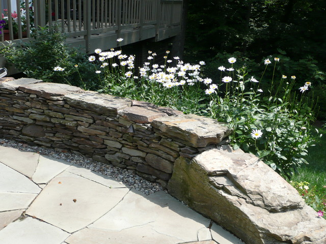 Outdoor flagstone patio with dry stack seat wall - Rustic - Patio ...
