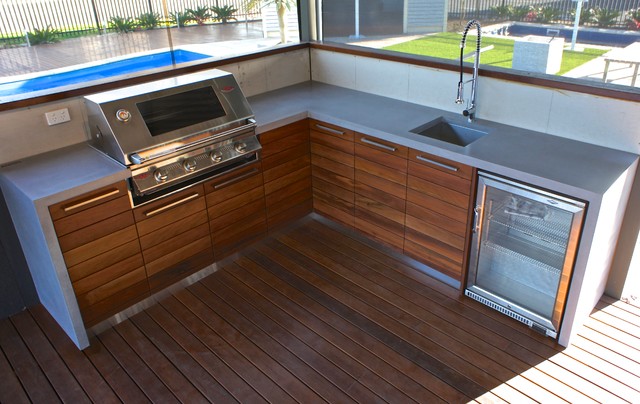 Outdoor Kitchen with a polished concrete benchtop & hardwood doors ...