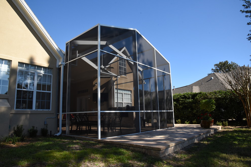 Outdoor kitchen with extended roof and screen enclosure - Traditional ...