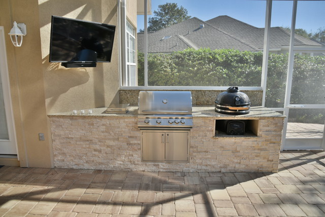 Outdoor kitchen with extended roof and screen enclosure - Traditional ...