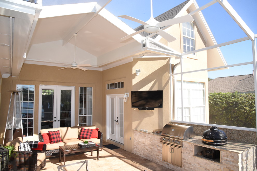 Outdoor kitchen with extended roof and screen enclosure - Traditional ...