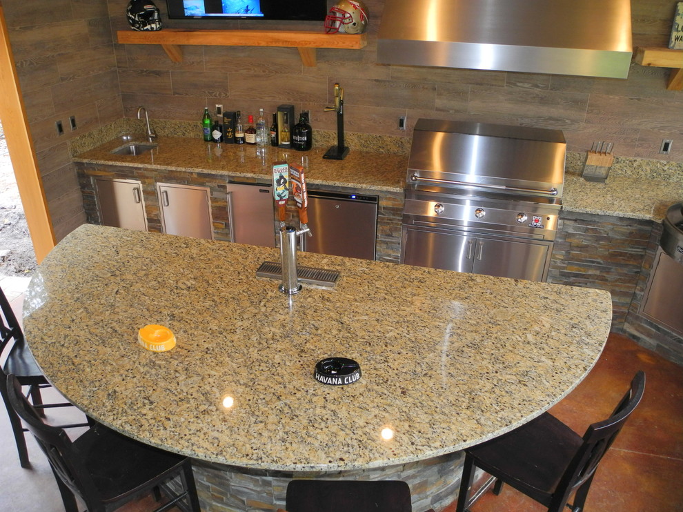 Outdoor kitchen with Solaire Grill, Evo Cooktop, kegerator and more ...